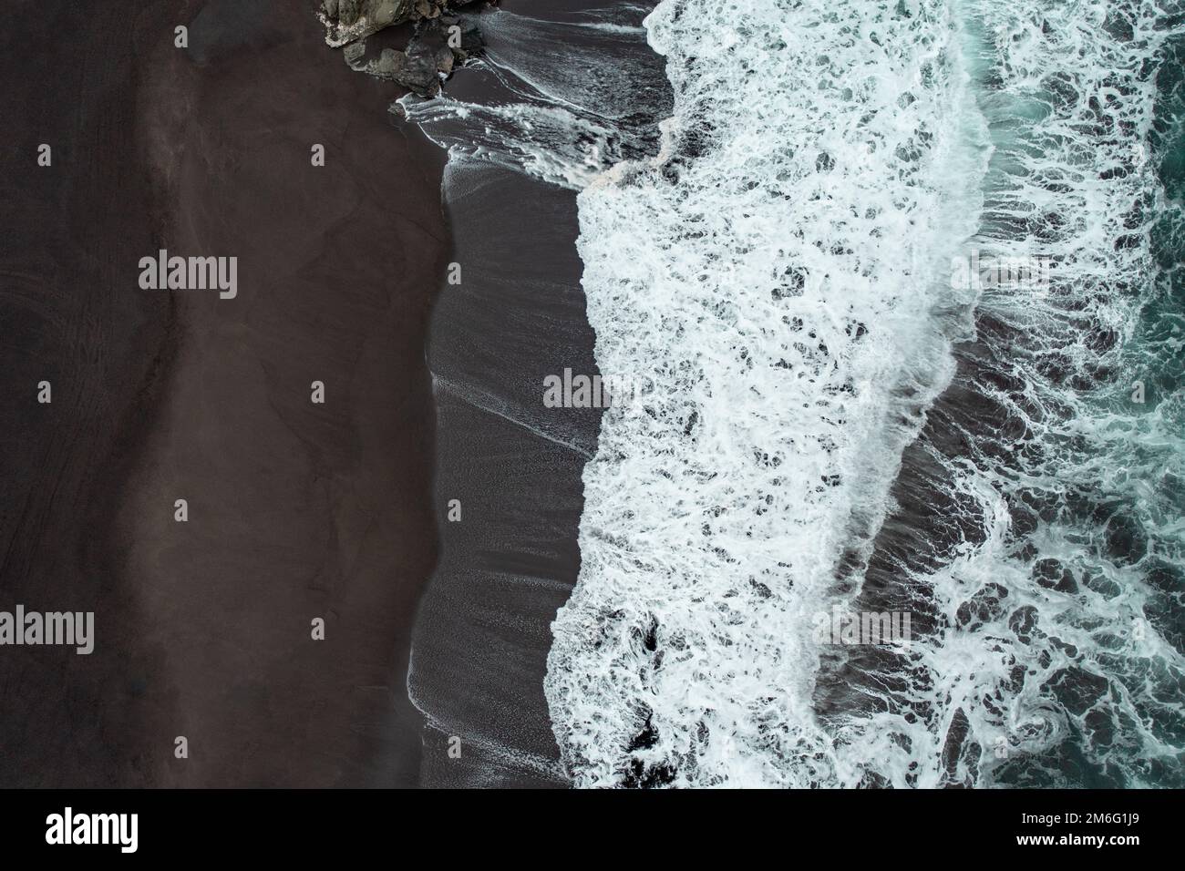 Aerial view of chilean ocean with black snd beach. Top view from drone ...