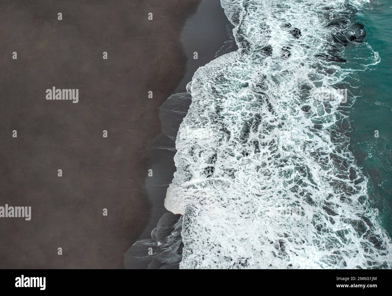 Aerial view of chilean ocean with black snd beach. Top view from drone ...