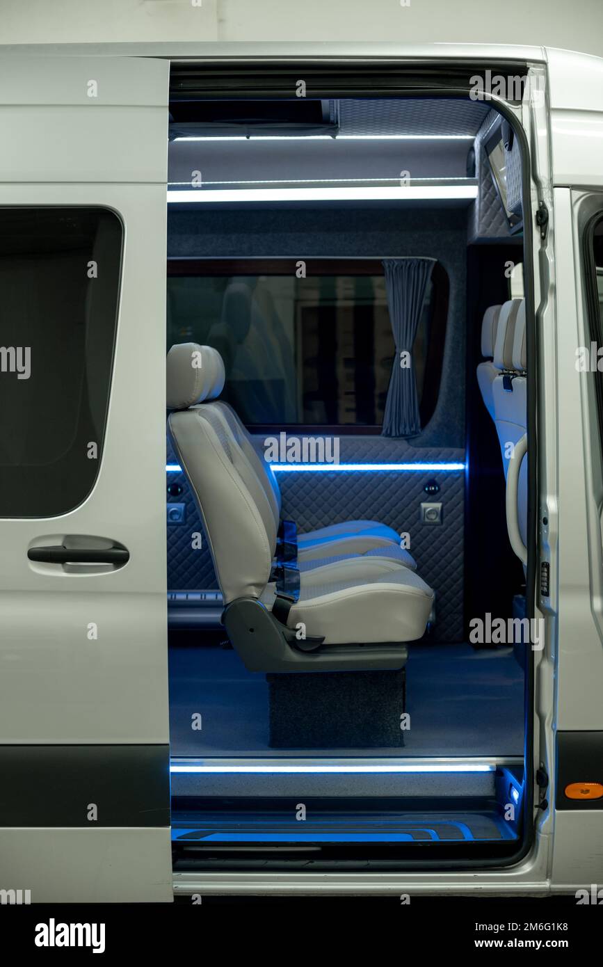 comfortable passenger bus interior with upholstered seats; individual ...