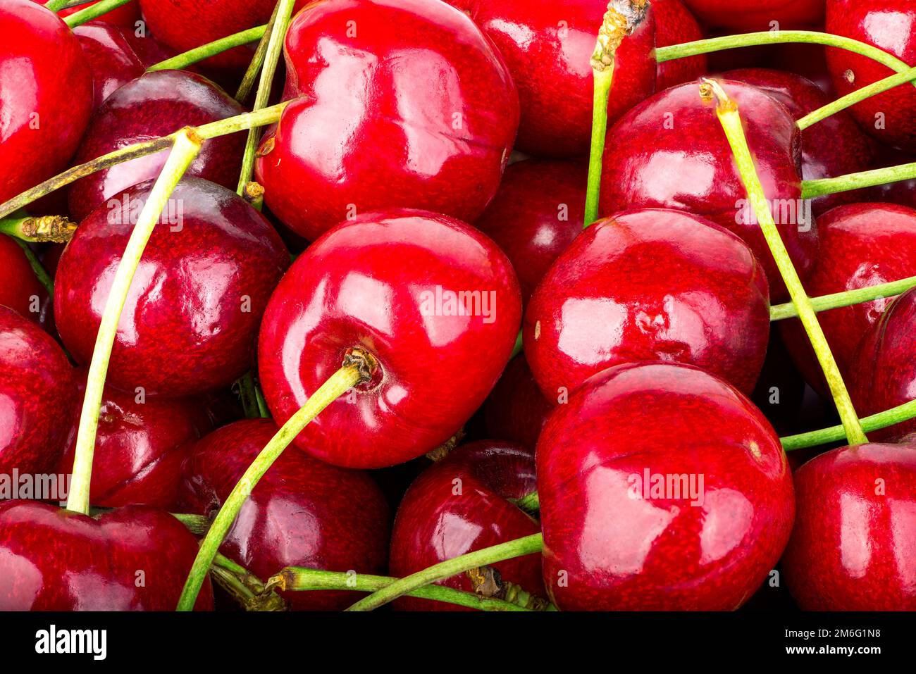 Red cherries background Stock Photo - Alamy