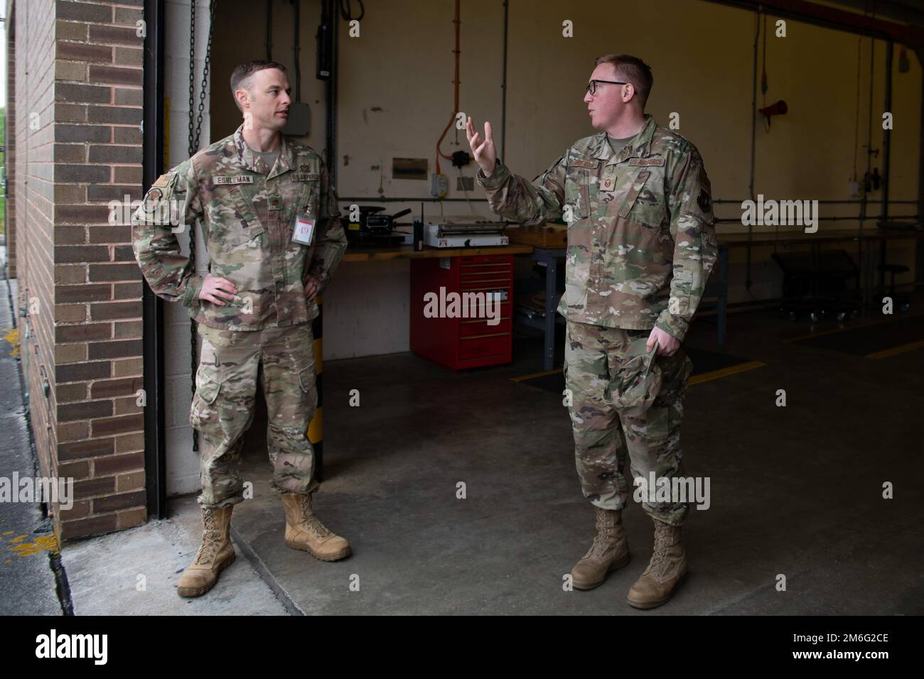 U.S. Air Force Master Sgt. Aaron Ridenour, right, 420th Munitions Squadron production flight ...