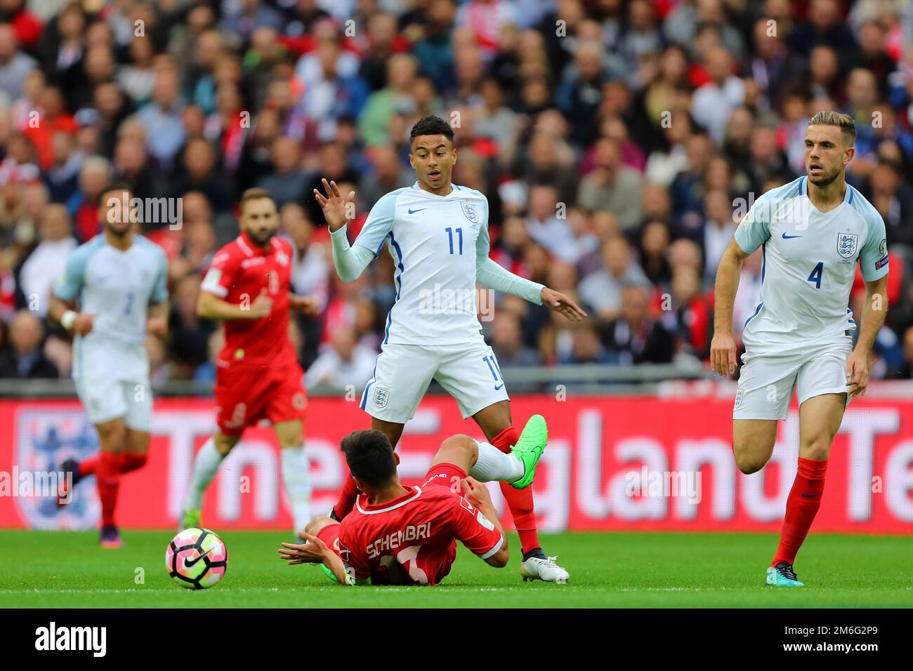Jesse Lingard of England and Andre Schembri of Malta - England v Malta ...