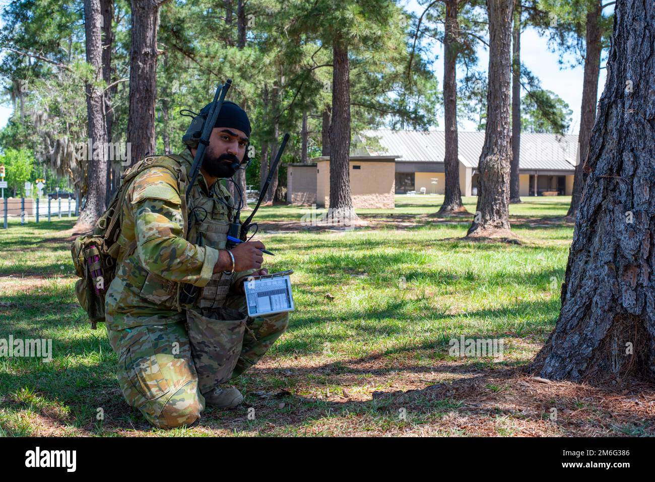 An Australian Army Joint Terminal Attack Controller listens to radio ...
