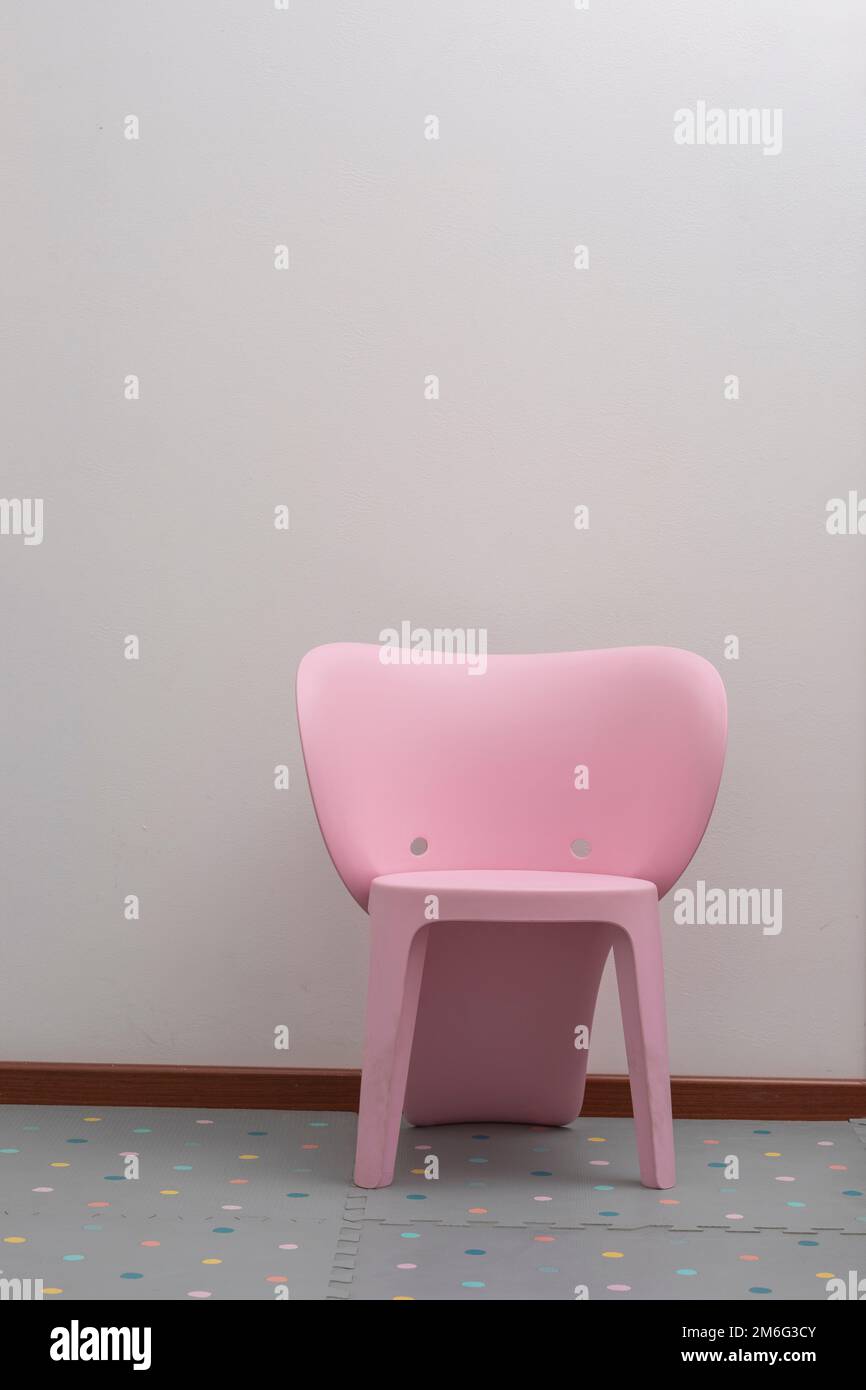 Girls pink chair in a room interior with white background and space for ...