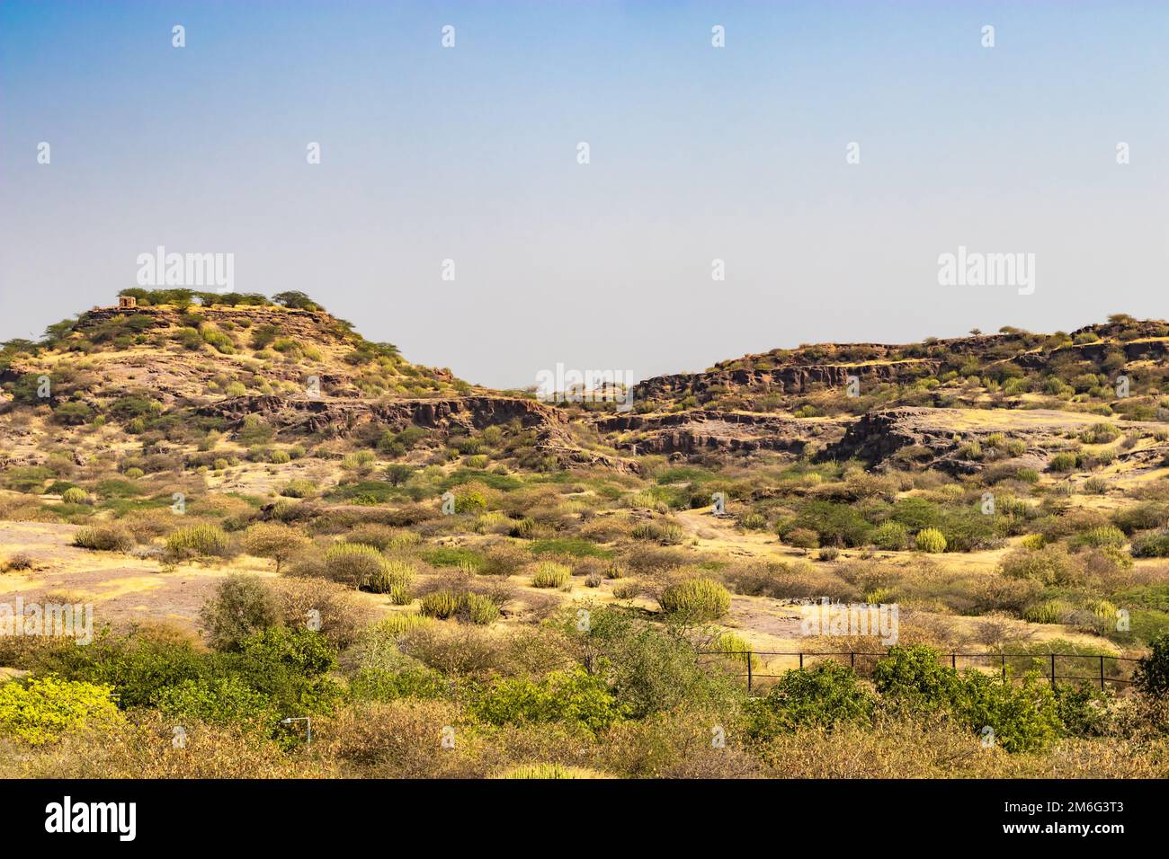 mountainous barren landscape with flat sky at evening from flat angle ...