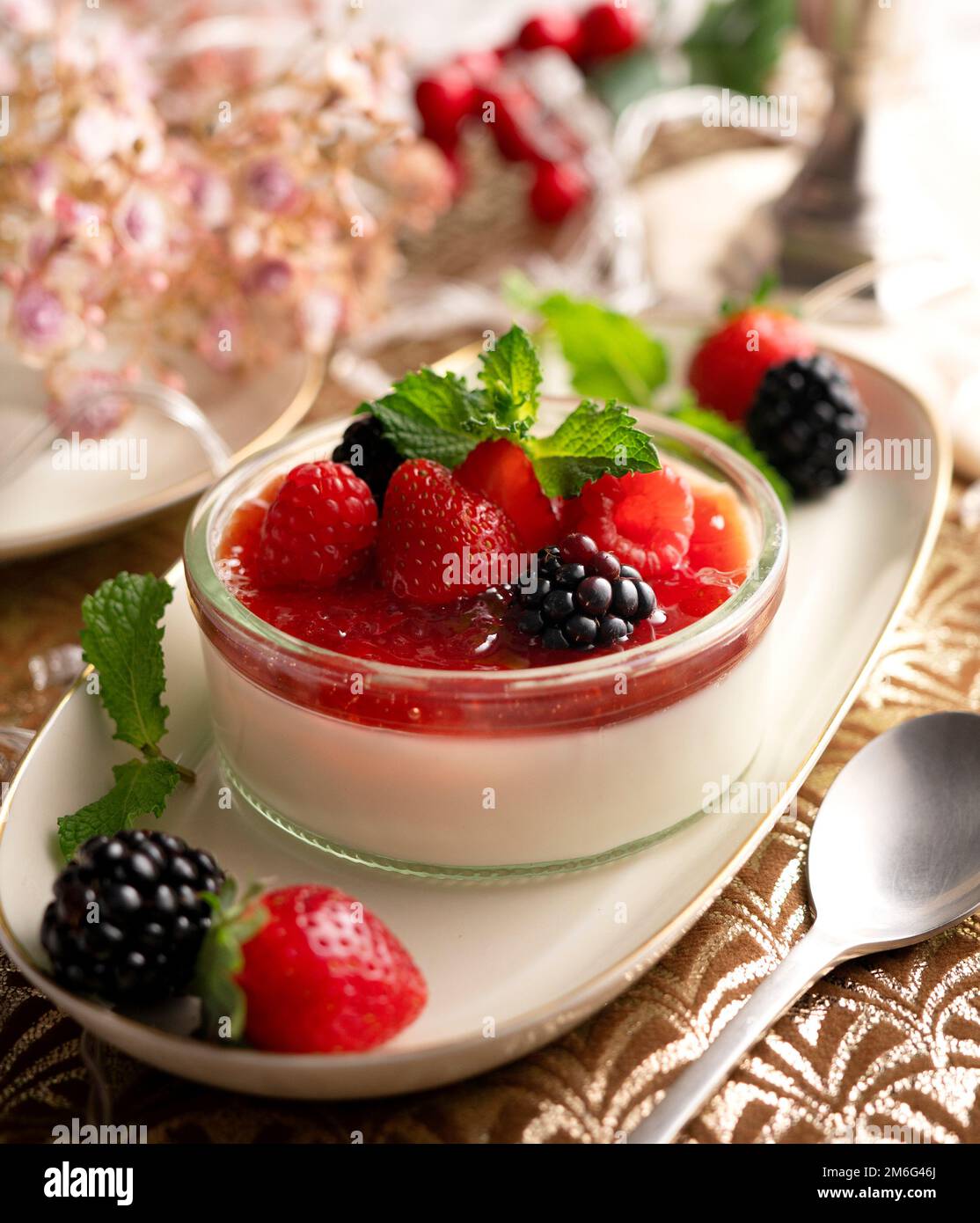 Red fruit panna cotta with strawberries. Italian recipe Stock Photo - Alamy