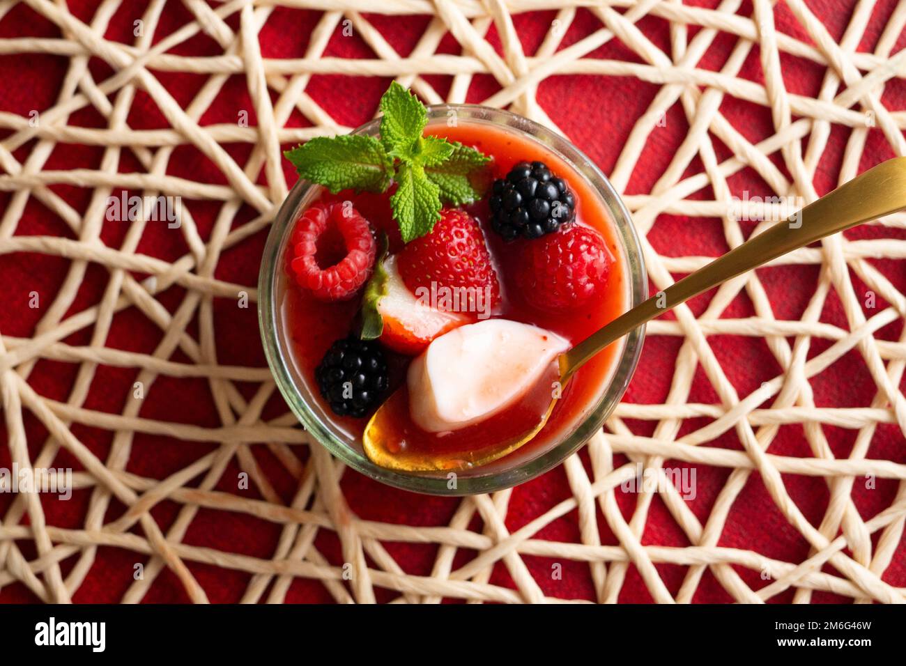 Red fruit panna cotta with strawberries. Italian recipe Stock Photo - Alamy