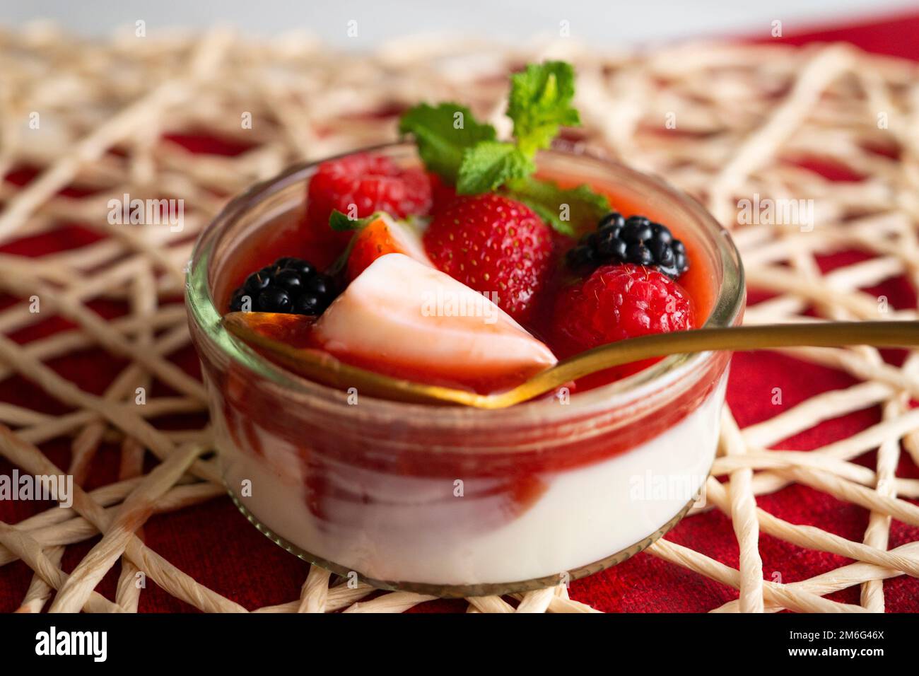 Red fruit panna cotta with strawberries. Italian recipe Stock Photo - Alamy