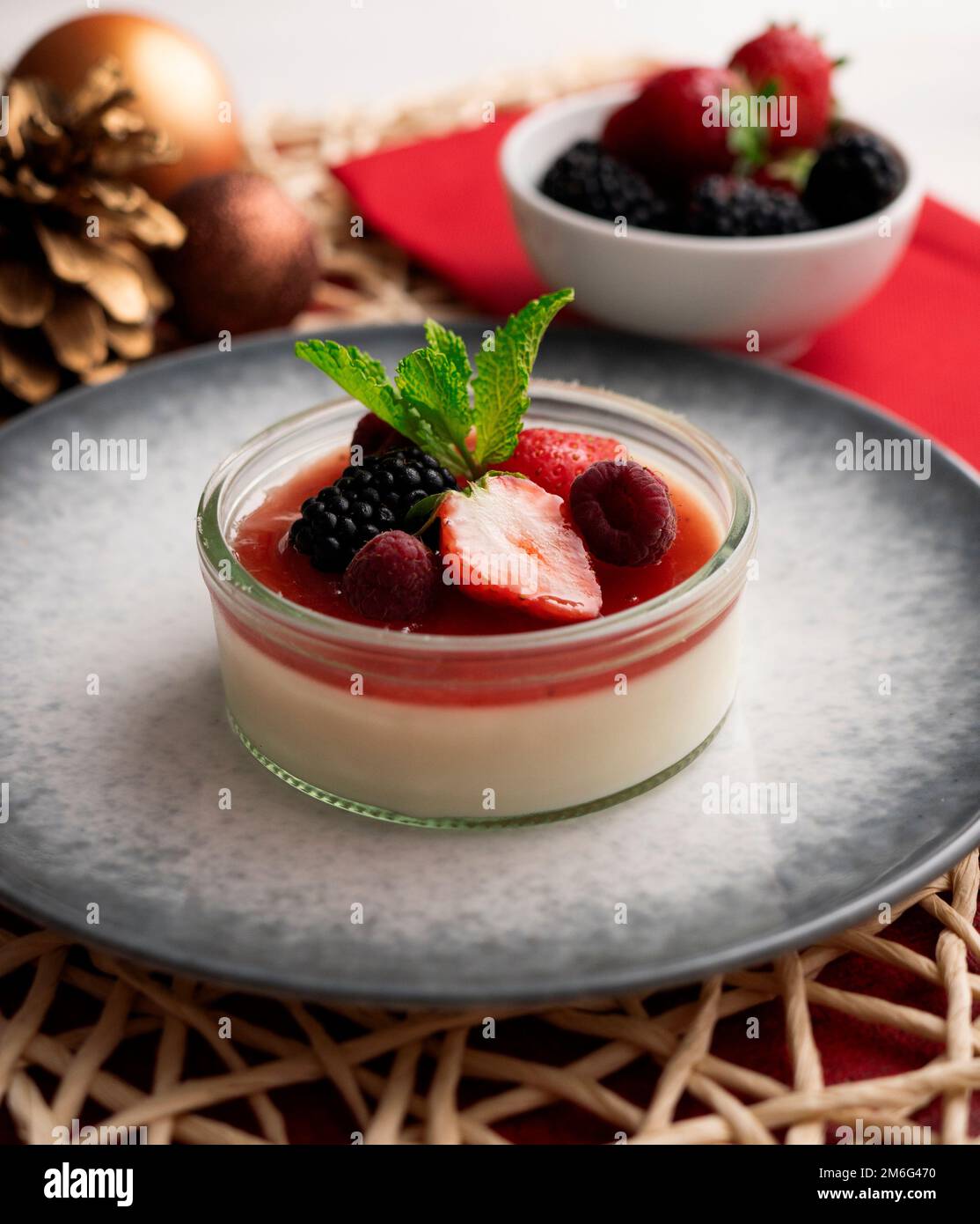 Red fruit panna cotta with strawberries. Italian recipe Stock Photo - Alamy