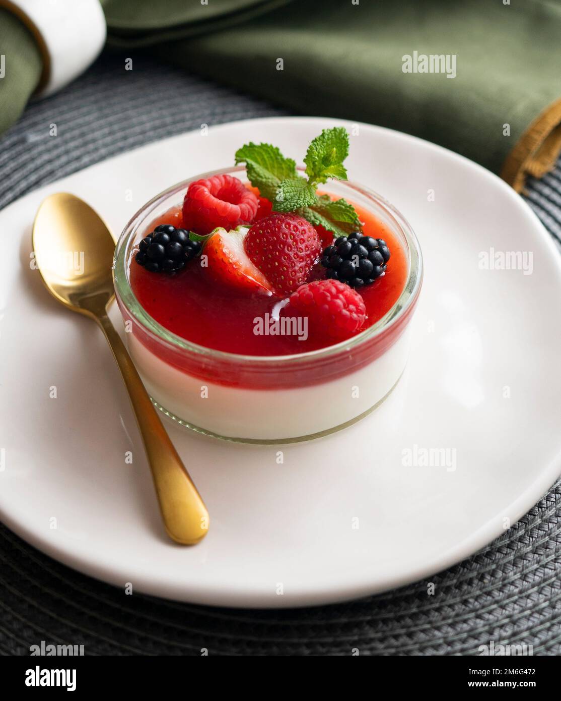 Red fruit panna cotta with strawberries. Italian recipe Stock Photo - Alamy