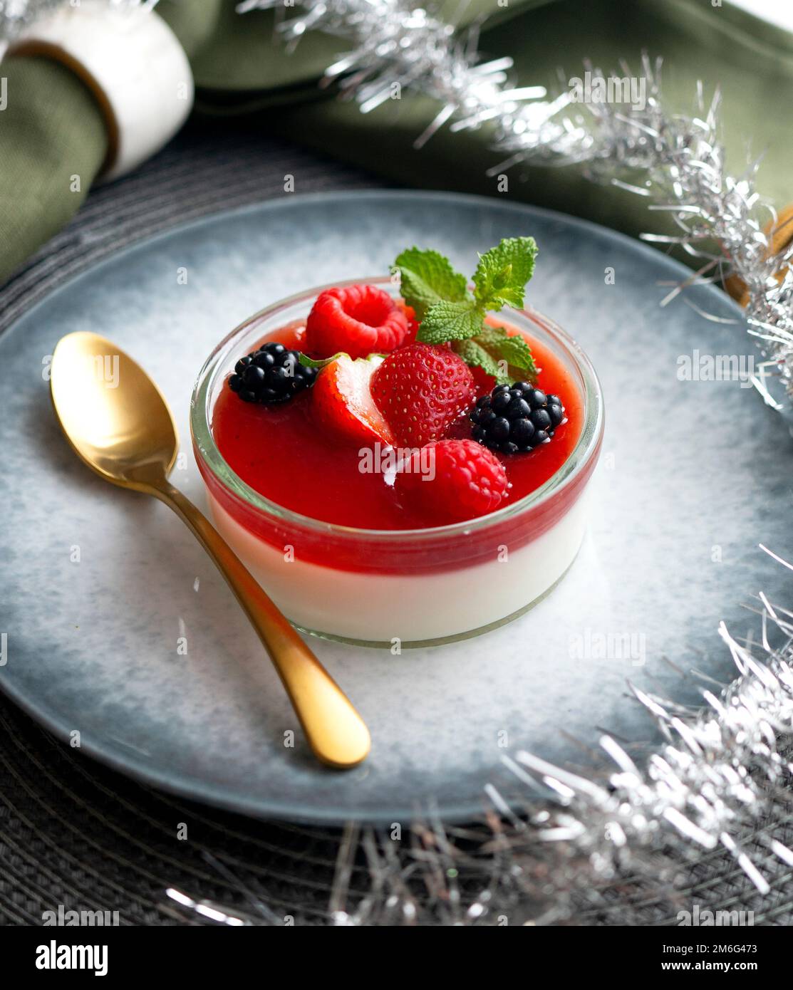 Red fruit panna cotta with strawberries. Italian recipe Stock Photo - Alamy