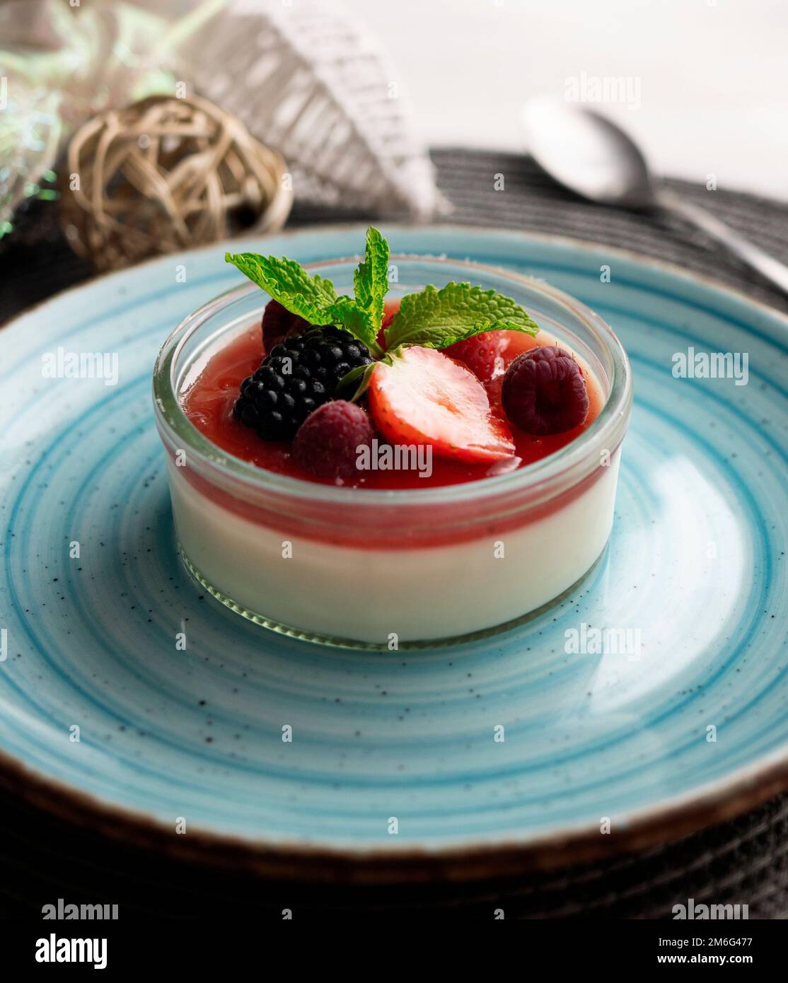 Red fruit panna cotta with strawberries. Italian recipe Stock Photo - Alamy