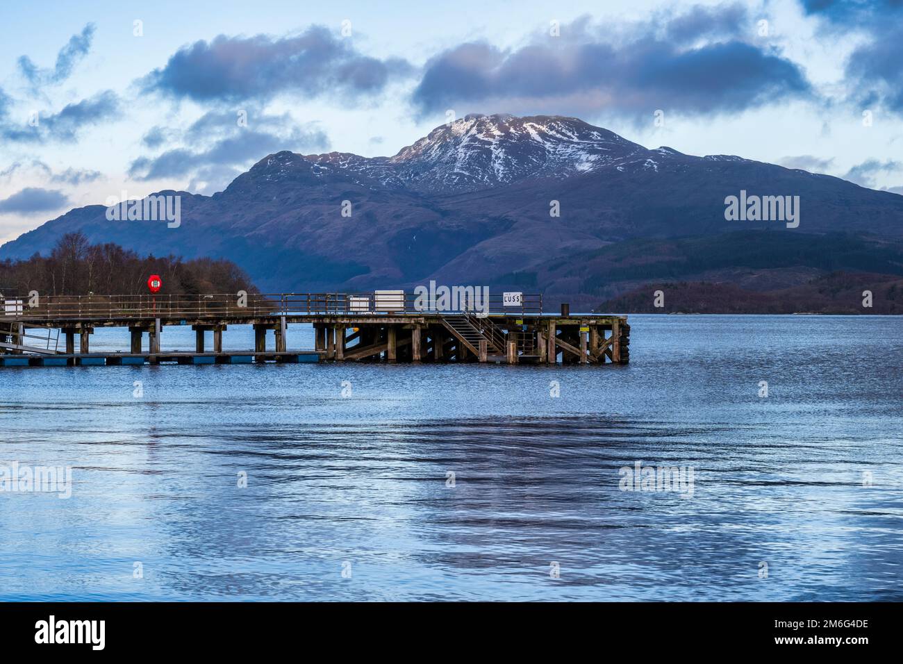 Luss Pier on Loch Lomond, with Ben Lomond dominating the winter skyline ...