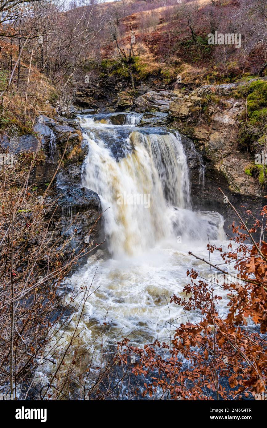 Winter view of Falls of Falloch, a picturesque waterfall in Loch Lomond ...