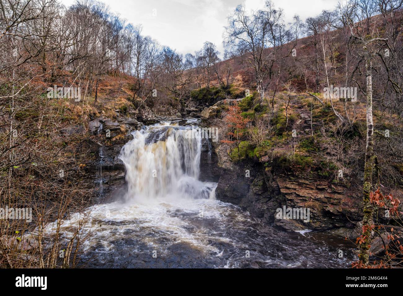 Winter view of Falls of Falloch, a picturesque waterfall in Loch Lomond ...