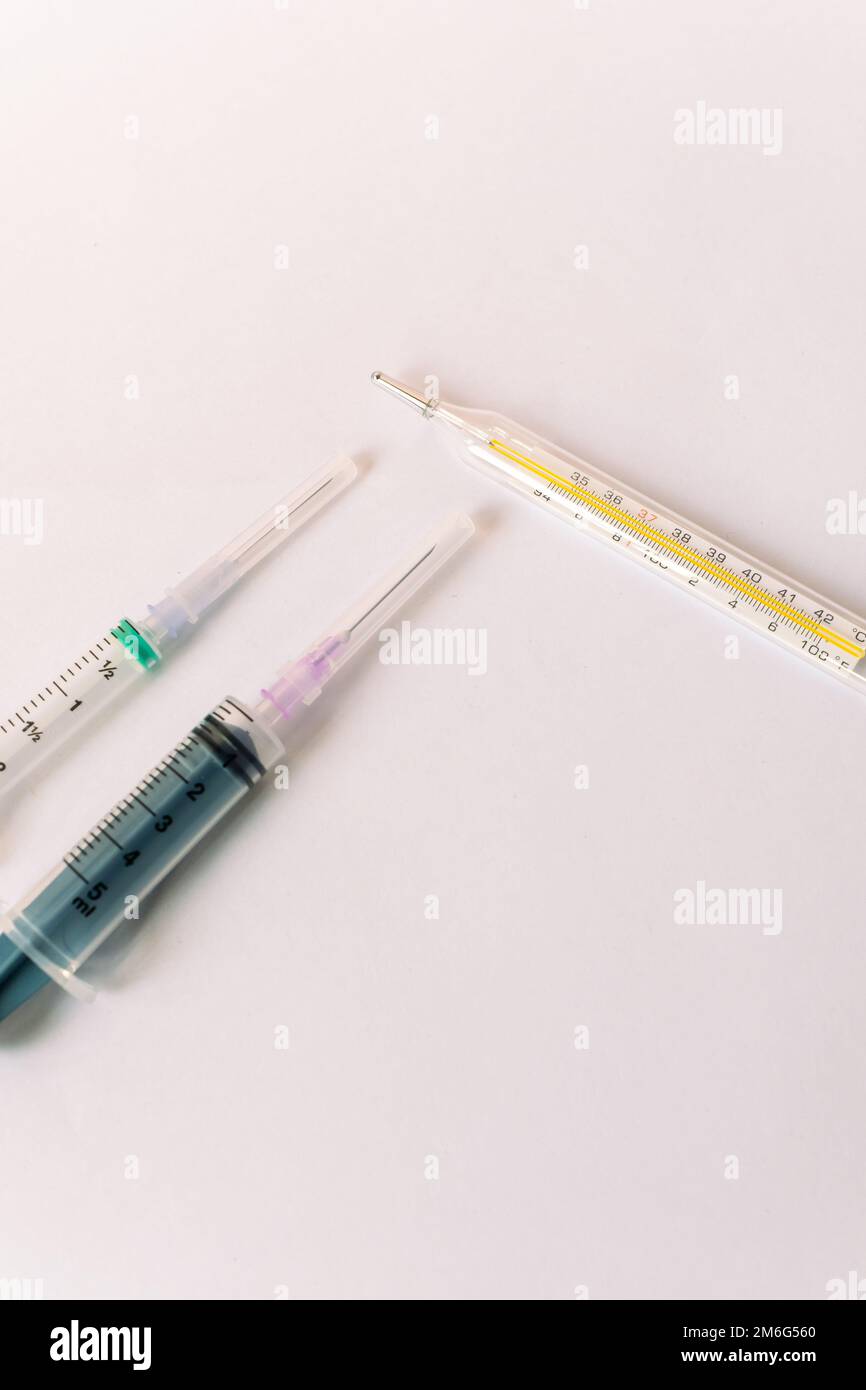 Thermometer, syringe, Concept of autumn common cold, covid or flu Stock ...