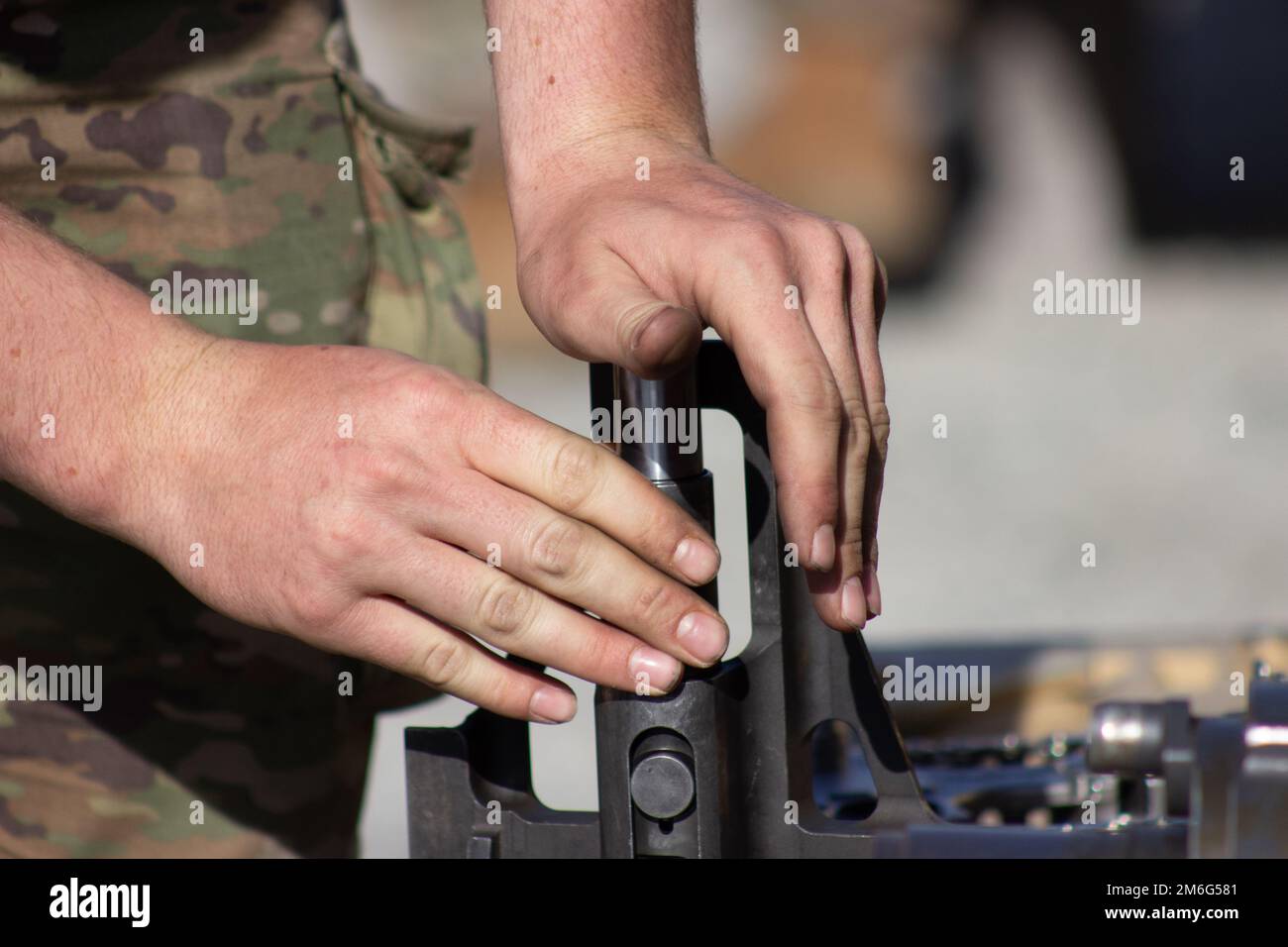 A U.S. Army soldier assembles a weapons system prior to the Sullivan at ...