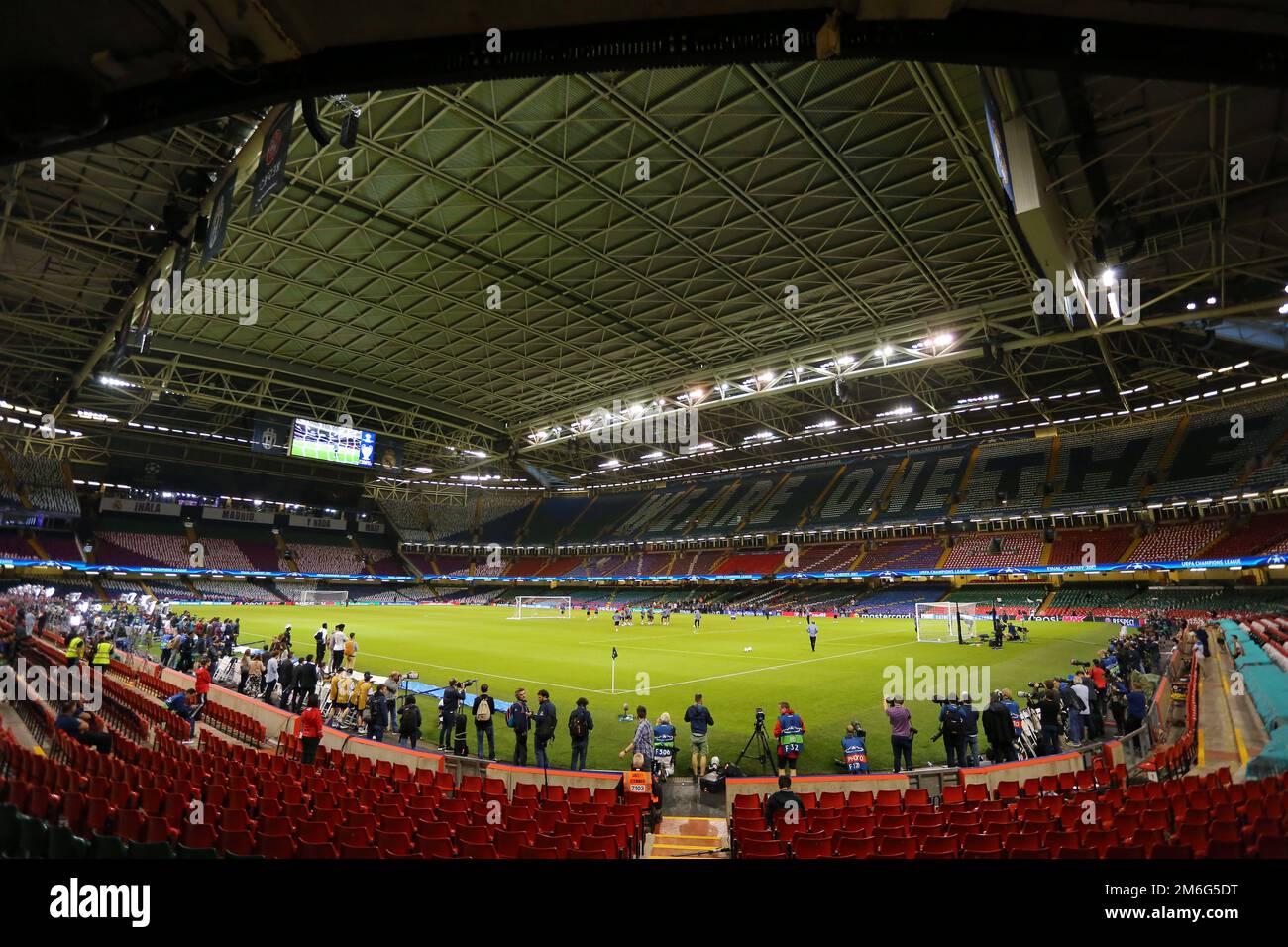 Real Madrid players train under the retractable roof of the National ...