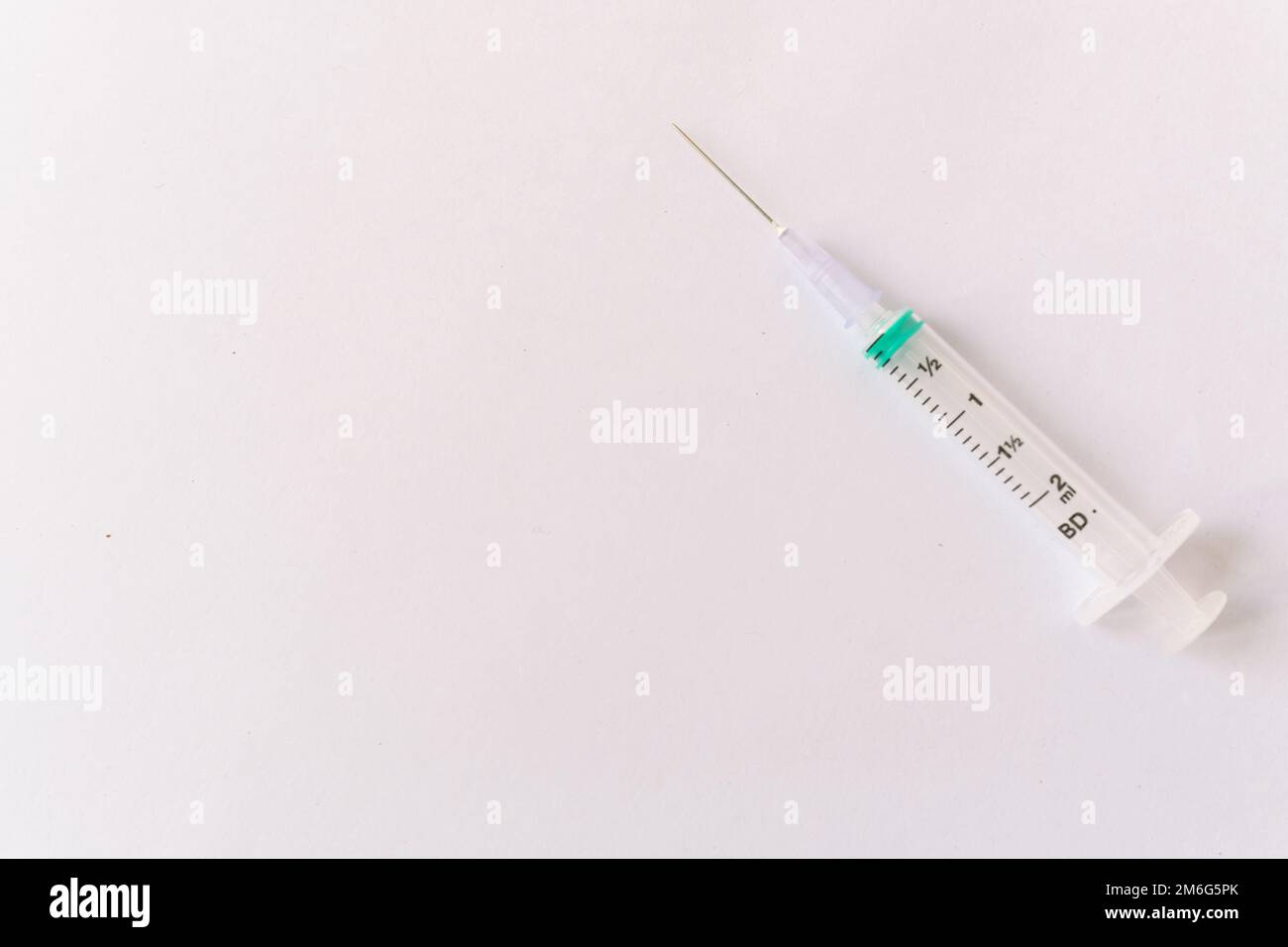 syringe on a white table prepared for injection in hospital Stock Photo ...