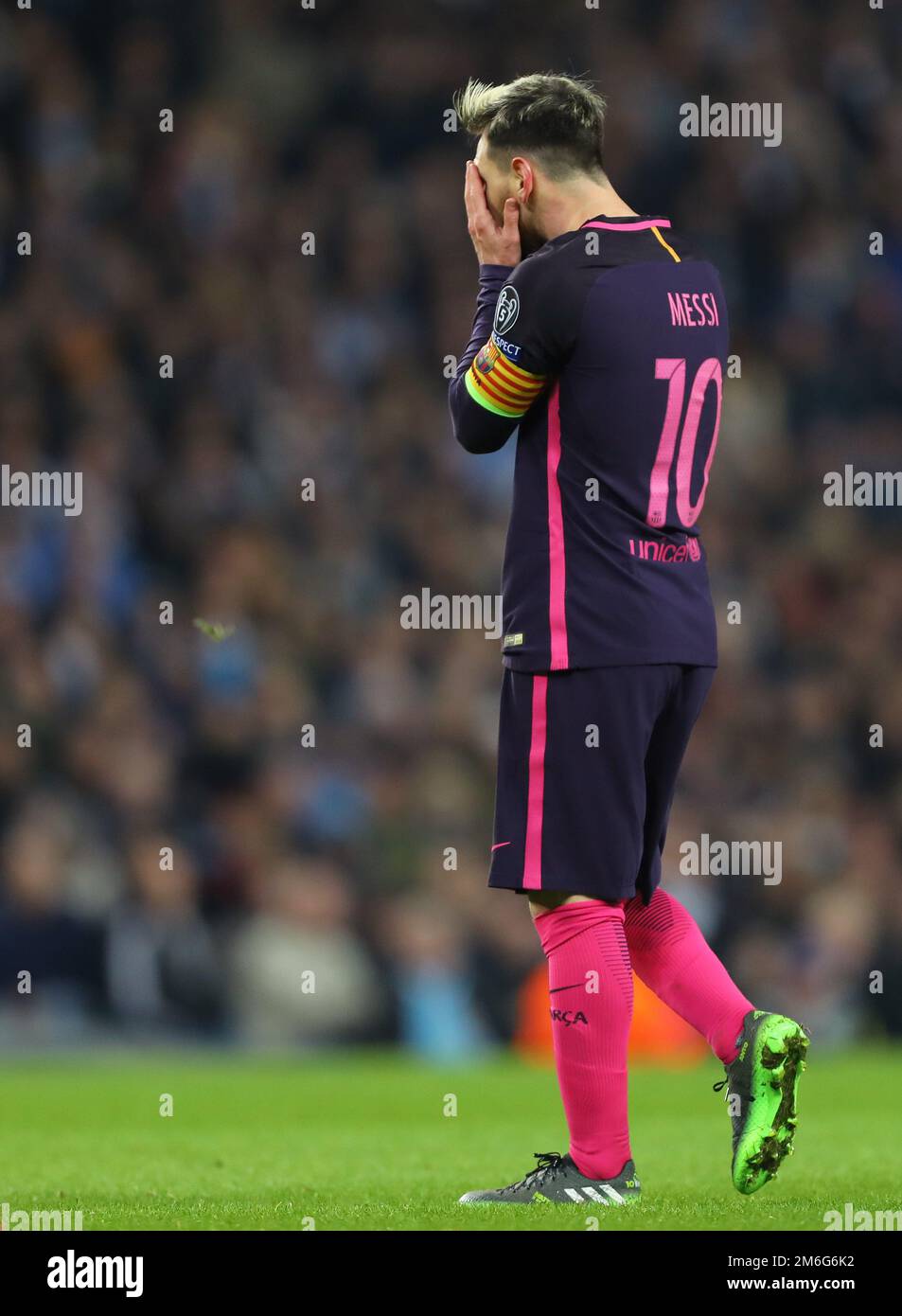 Lionel Messi of Barcelona holds his face during the defeat to ...
