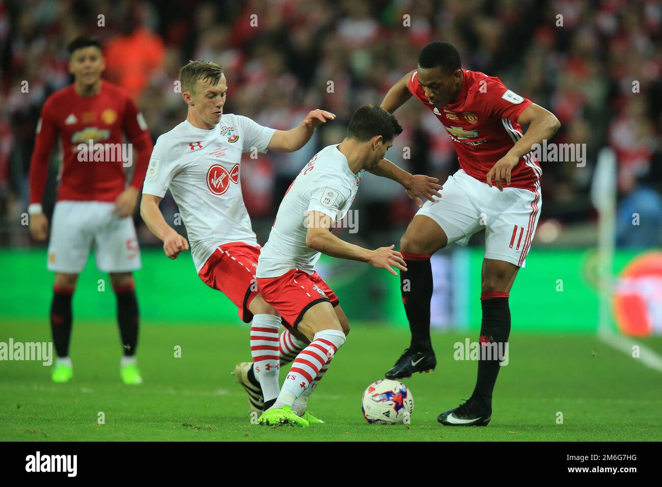 Anthony Martial of Manchester United dribbles under pressure from ...