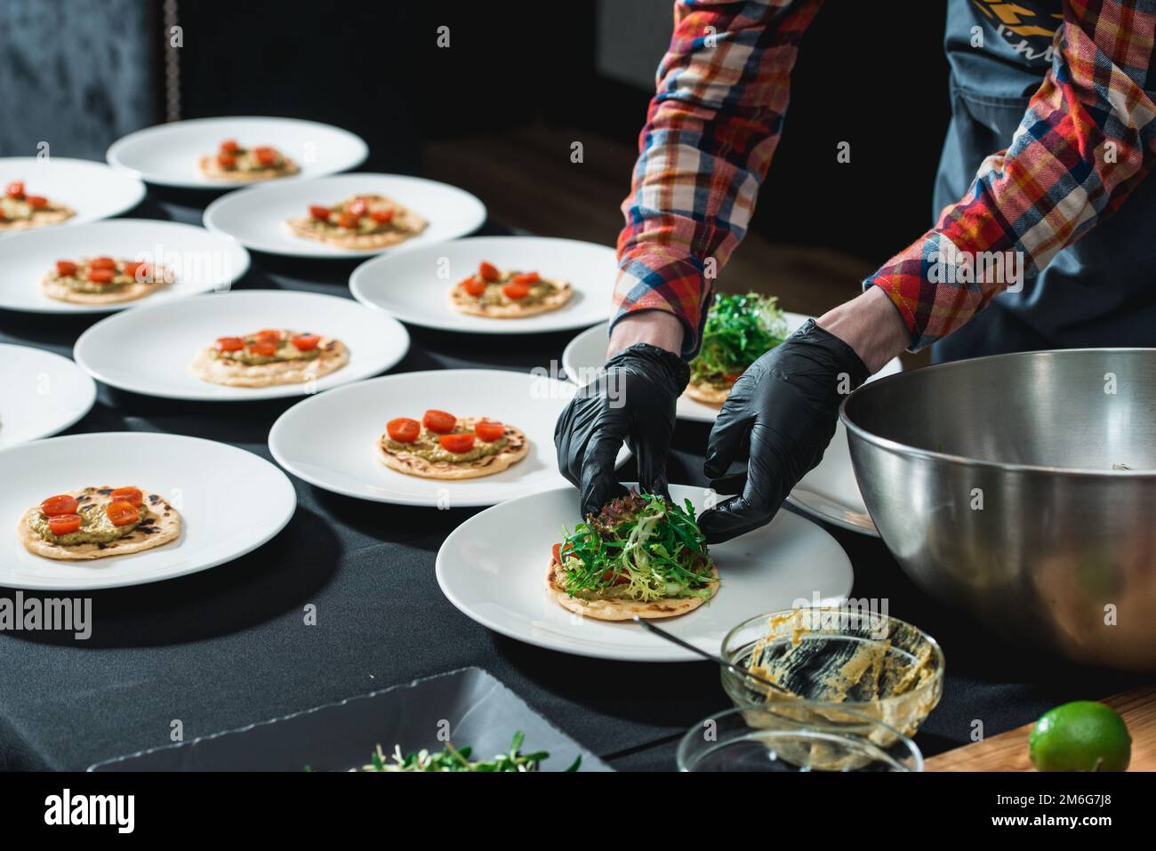 The chef at the restaurant making Spicy Shrimp Tacos with Coleslaw and ...