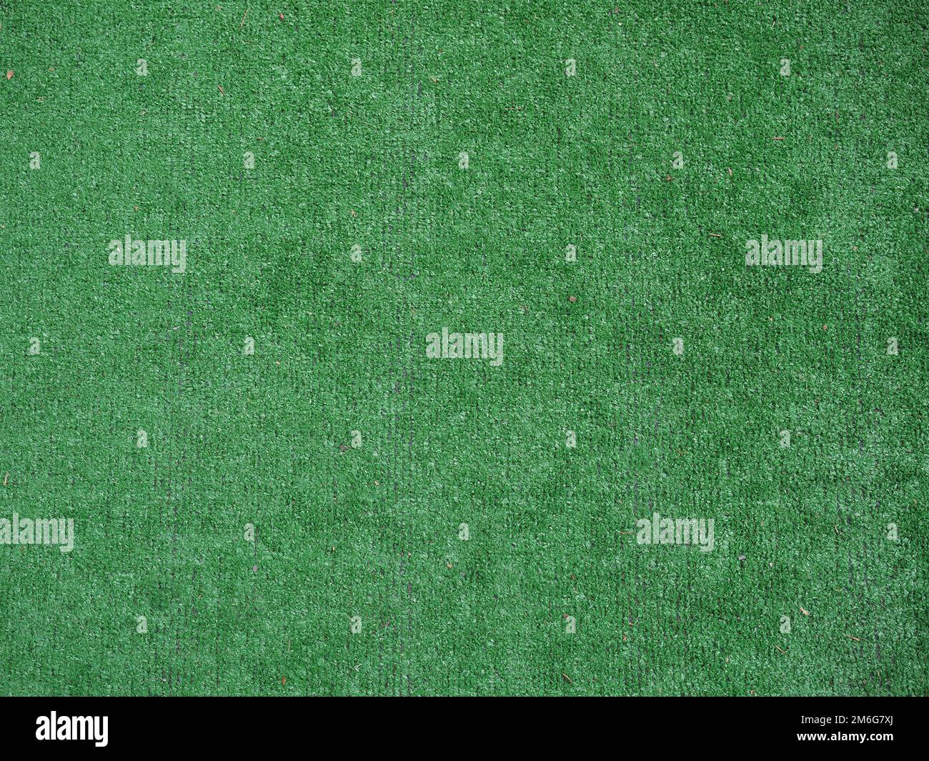 Green synthetic grass texture background Stock Photo - Alamy