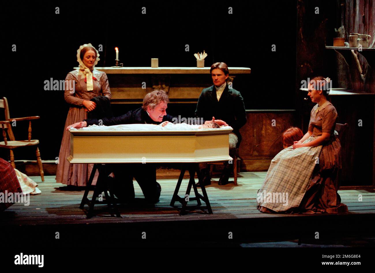 mourning Tiny Tim - l-r: Polly James (Mrs Cratchit), Paul Greenwood ...
