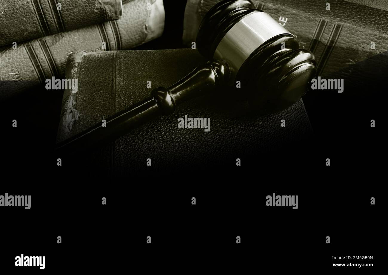 Gavel on old law books with blank black copyspace background Stock ...