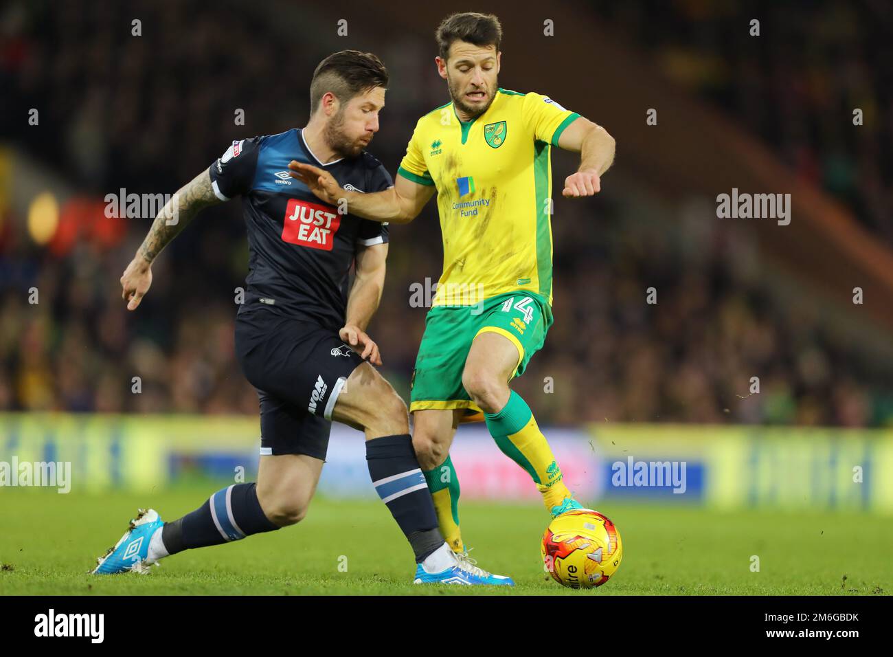 Wesley Hoolahan of Norwich City and Jacob Butterfield of Derby County ...