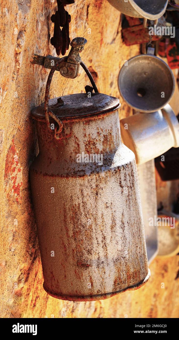 Aluminium milk can Hanging on the Wall. Grunge Rusty Milk Churn Stock ...