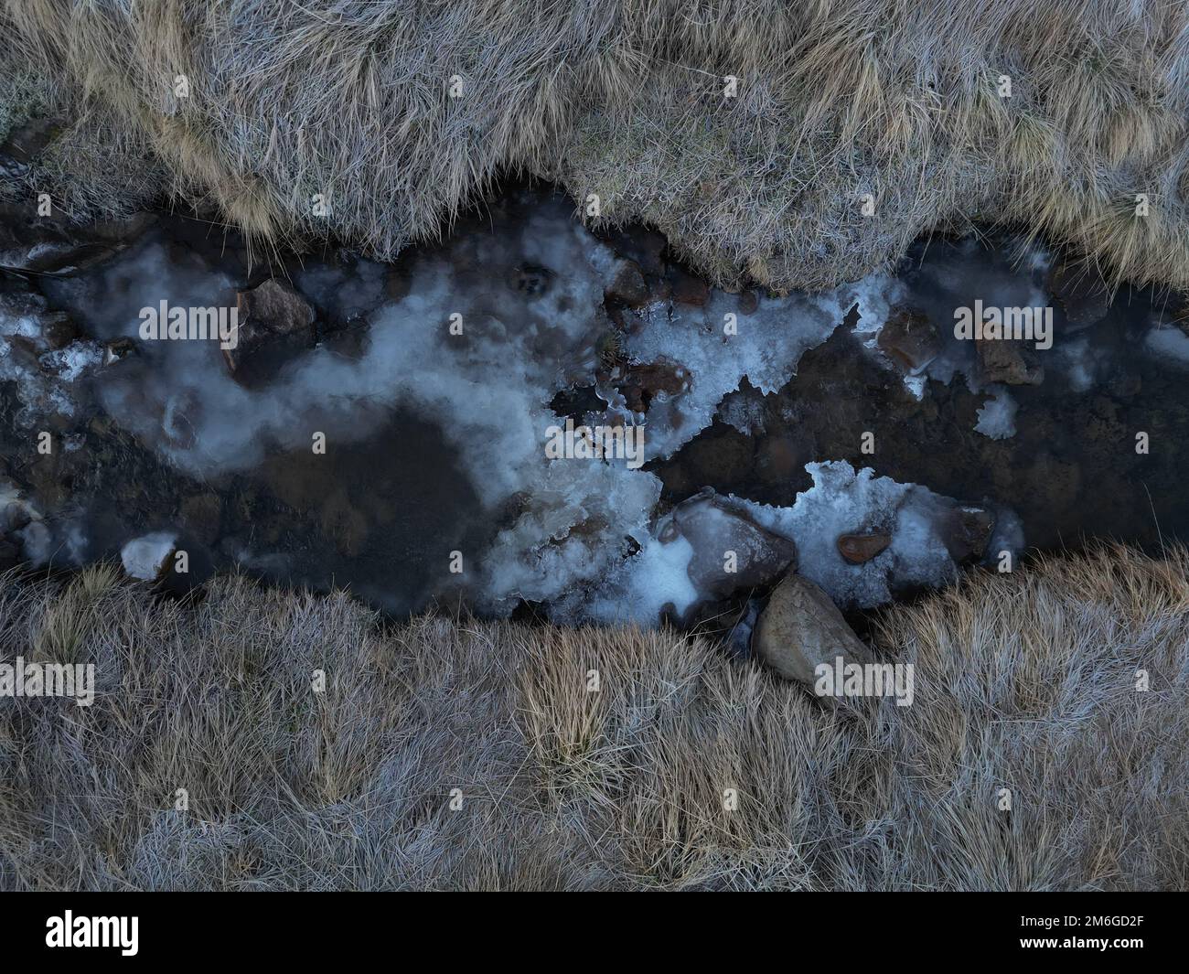 Half frozen stream in Ólafsfjörður December 2022 Stock Photo - Alamy