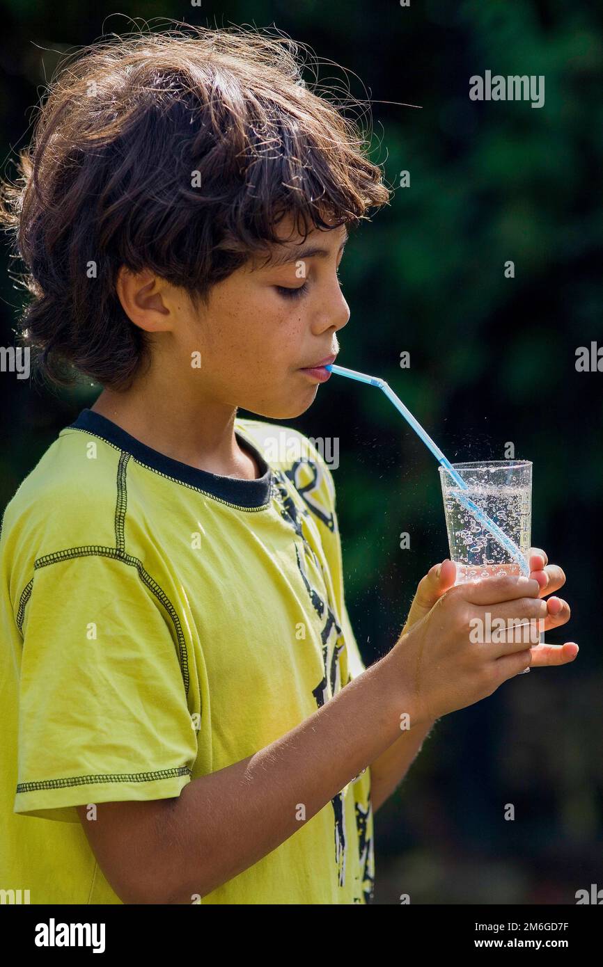 Boy drinking water straw hi-res stock photography and images - Alamy