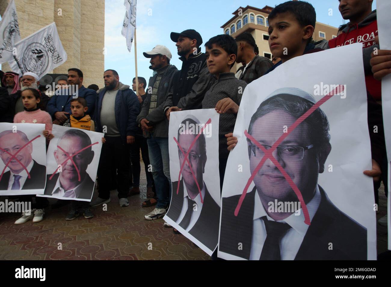 Palestinian protesters display crossed-out portraits of Israeli Prime ...