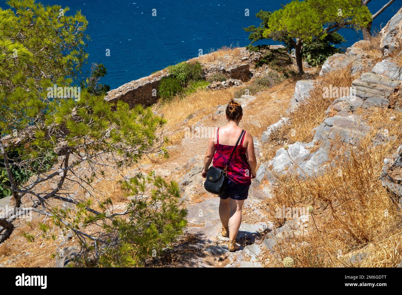 Woman climbing down steps hi-res stock photography and images - Alamy
