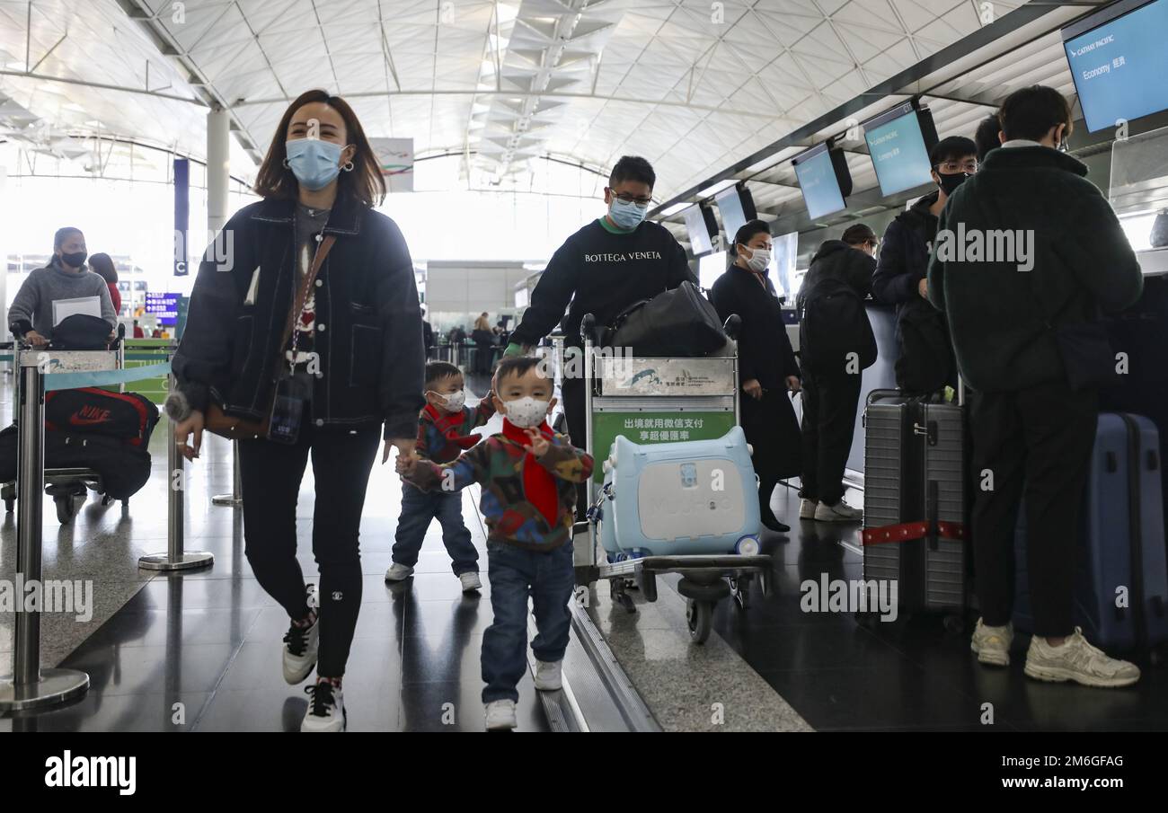 Joyce Wong and her husband Michael Kam take their three -year-old twin ...