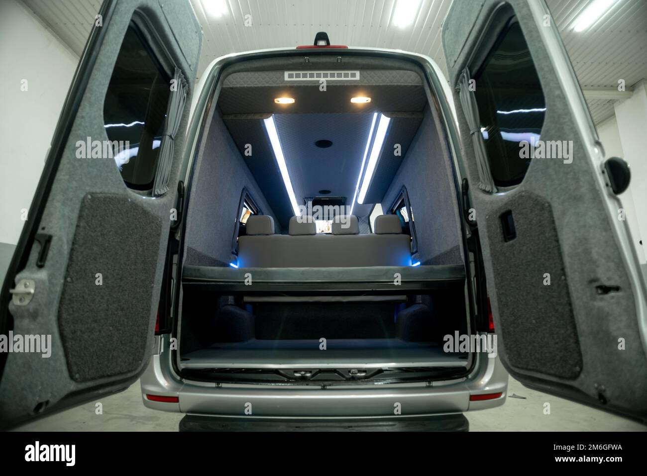 comfortable passenger bus interior with upholstered seats; individual ...