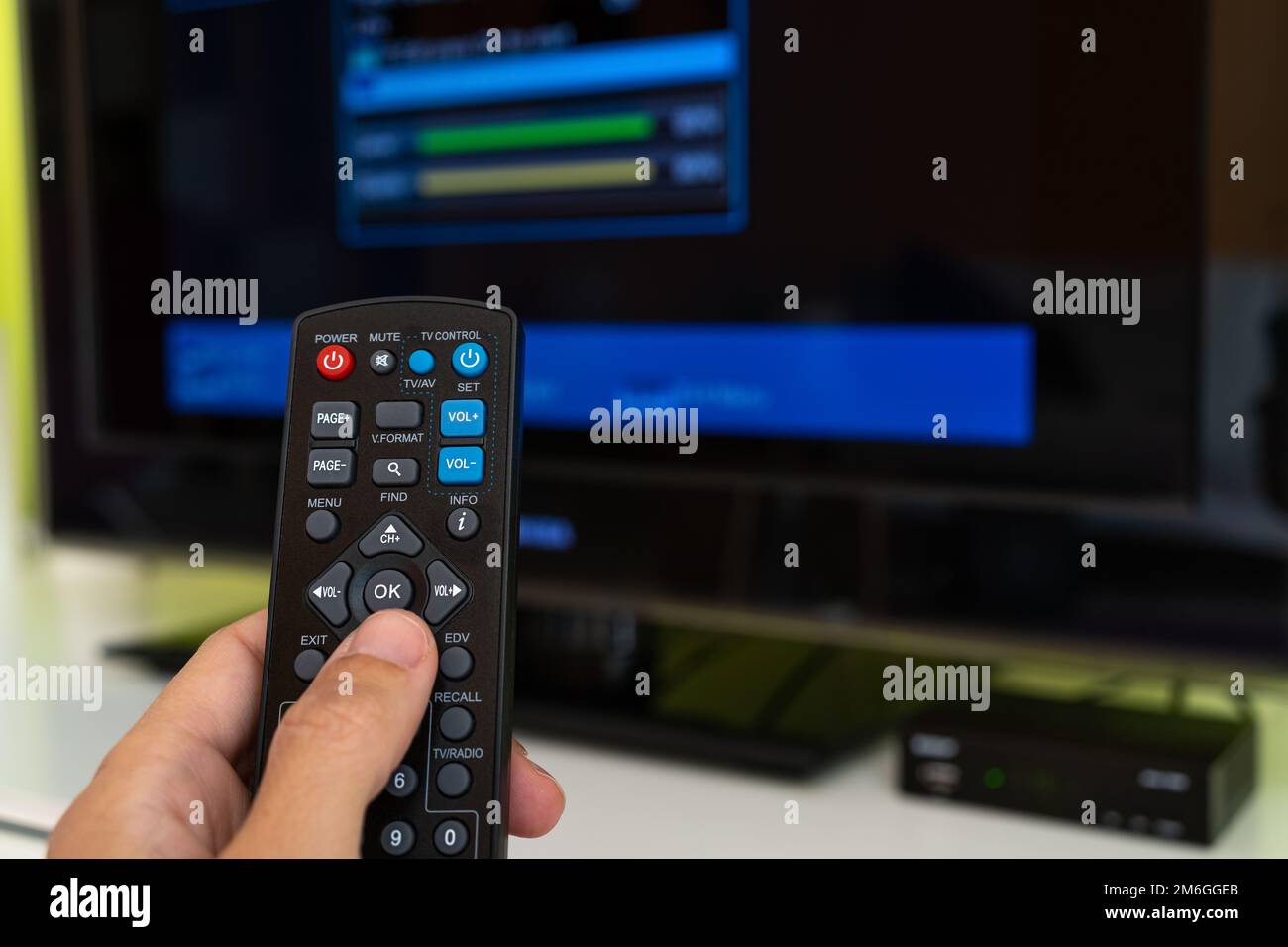 Digital decoder with remote control and television monitor Stock Photo ...