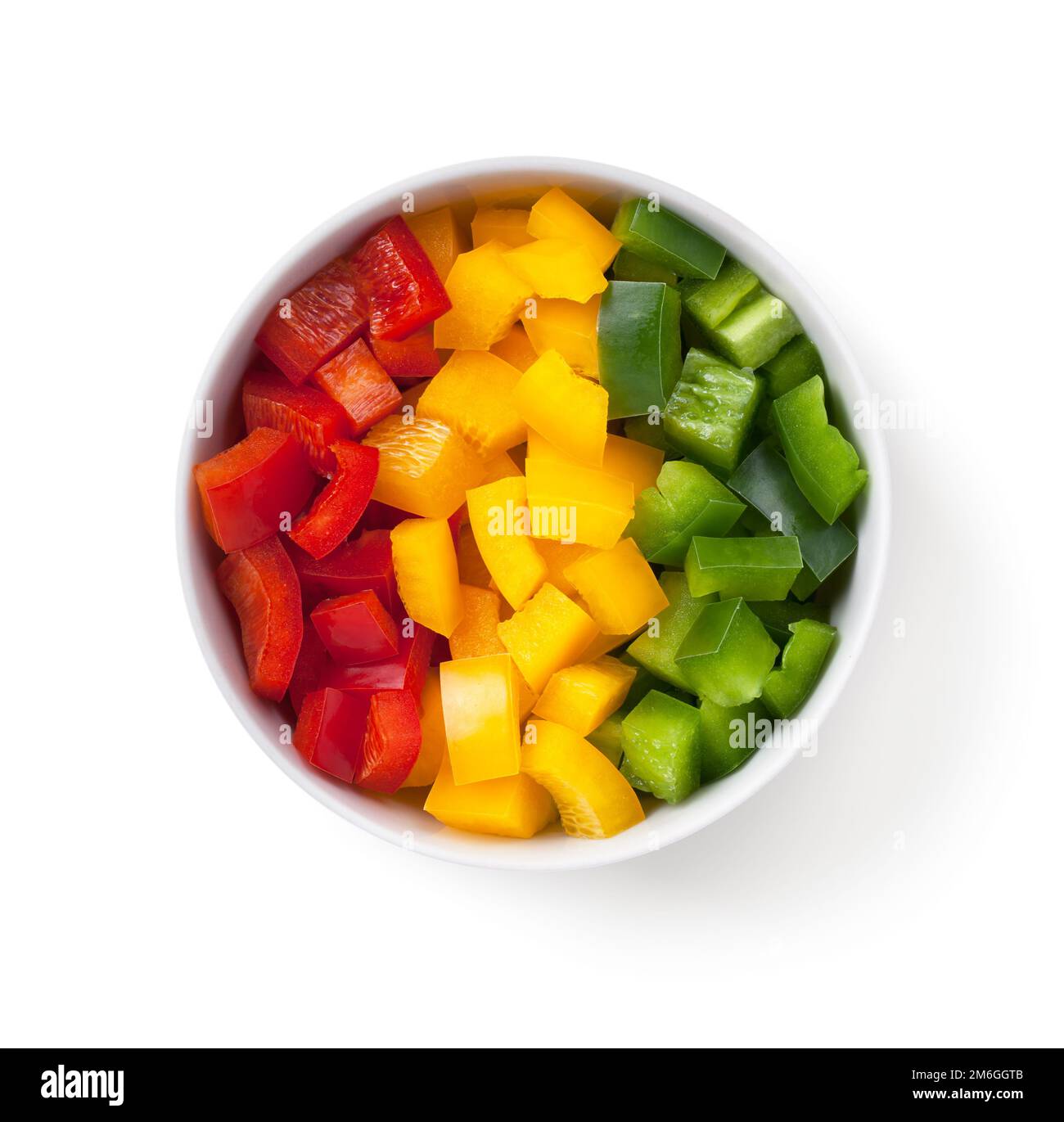 Cut Pepper Pieces In White Bowl Isolated Stock Photo - Alamy