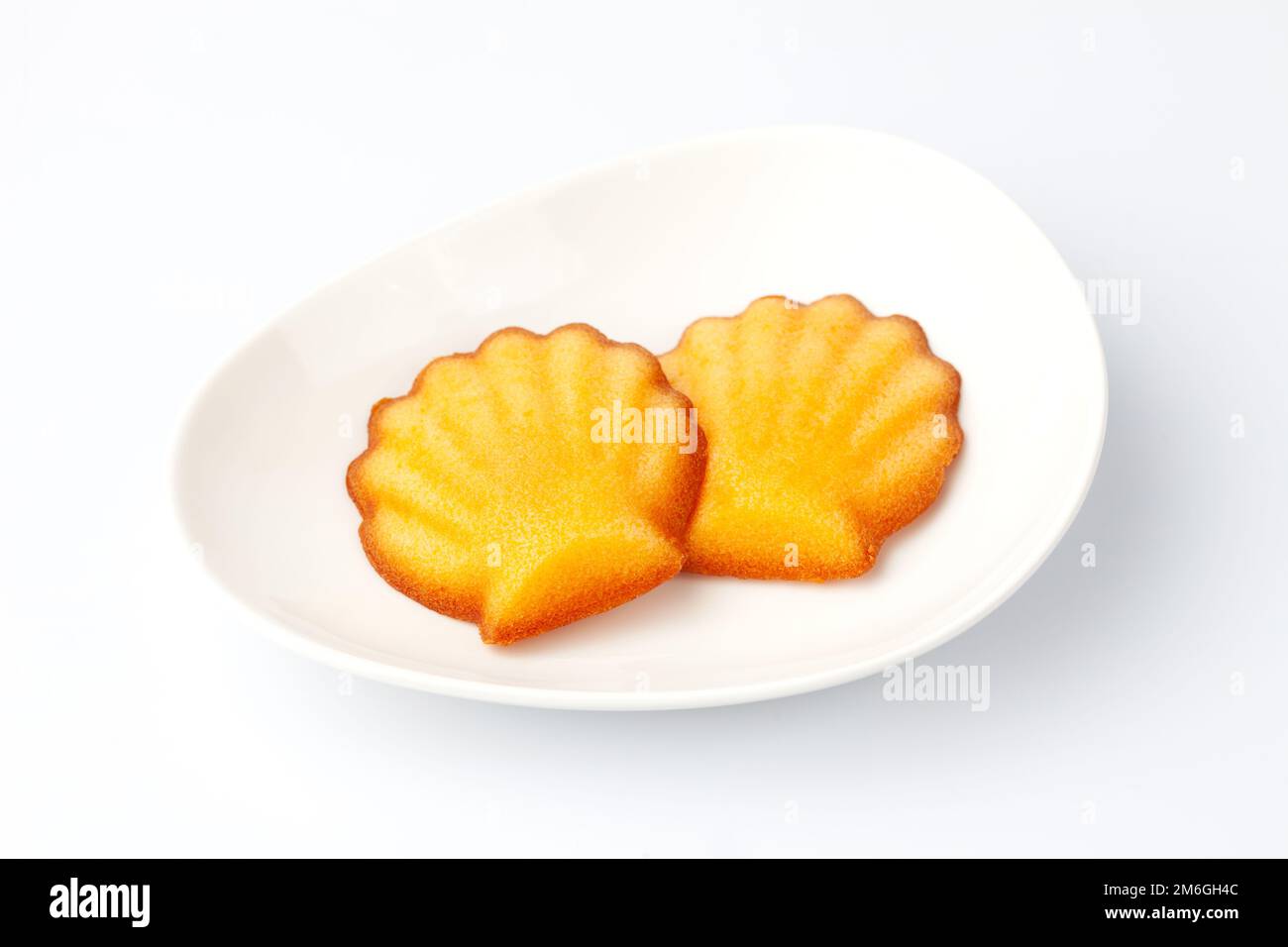 madeleine french pastry isolated on white background Stock Photo - Alamy