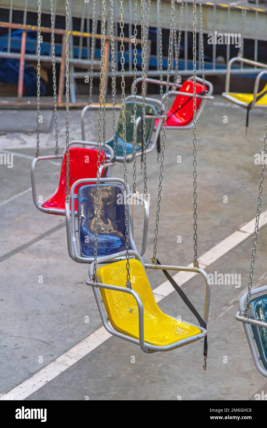 Colourful Chair Swing Ride at Amusement Park in Hall Stock Photo - Alamy