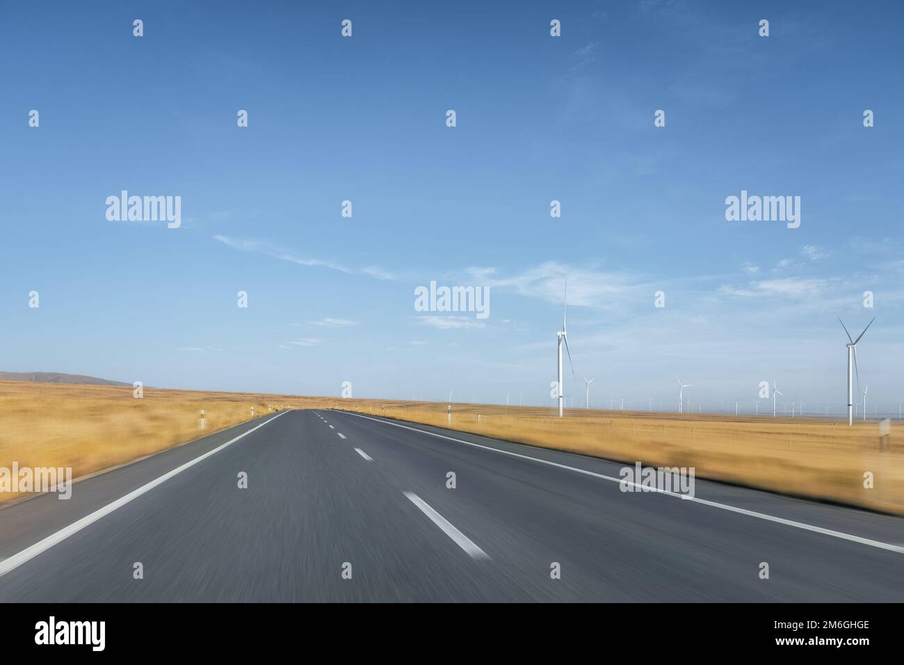 Empty road through grassland view and wind farm Stock Photo - Alamy Empty road through grassland view and wind farm Stock Photo - Alamy