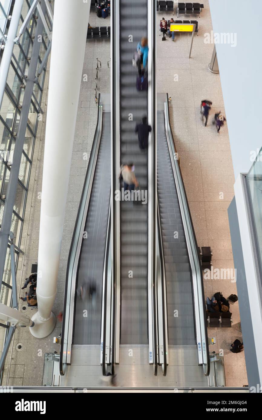 A traveller uses an escalator in Heathrow Terminal 5 in London Stock ...