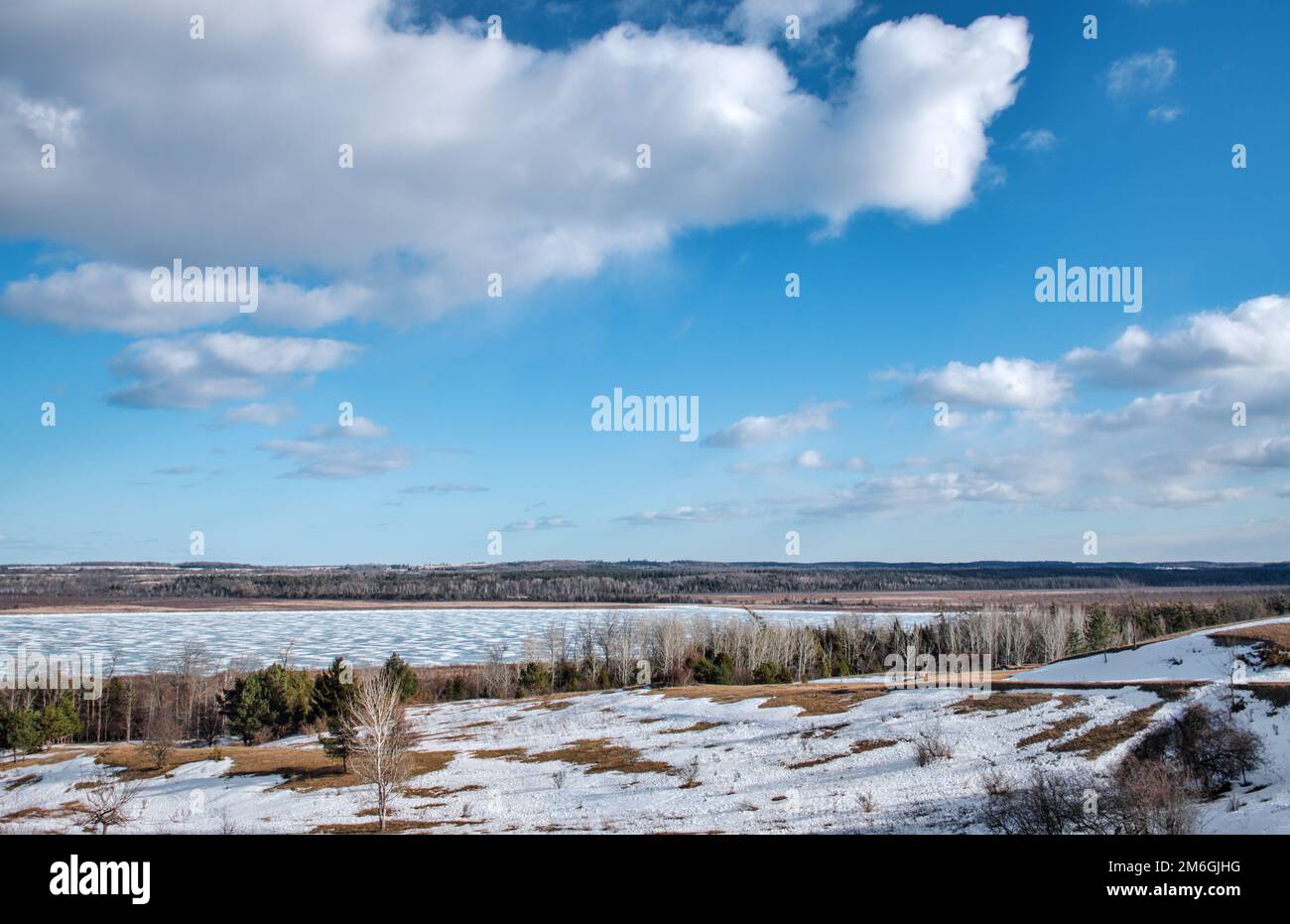 Lake Scugog winter landscape with forest and frozen lake in Port Perry ...