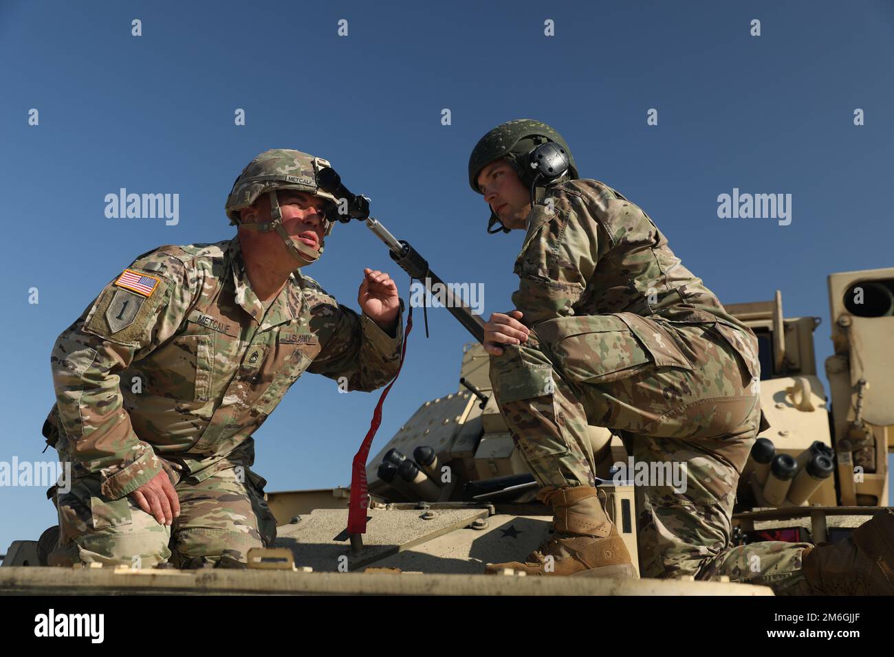 From left, U.S. Army Sgt. 1st Class Michael Metcalf, a gunnery coach ...