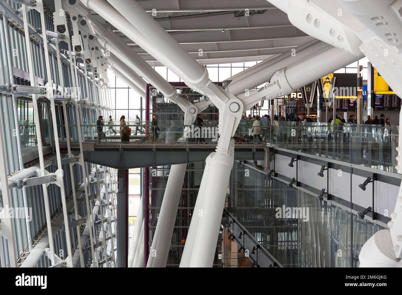 Travellers move through Heathrow Airport Terminal 5 in London Stock ...