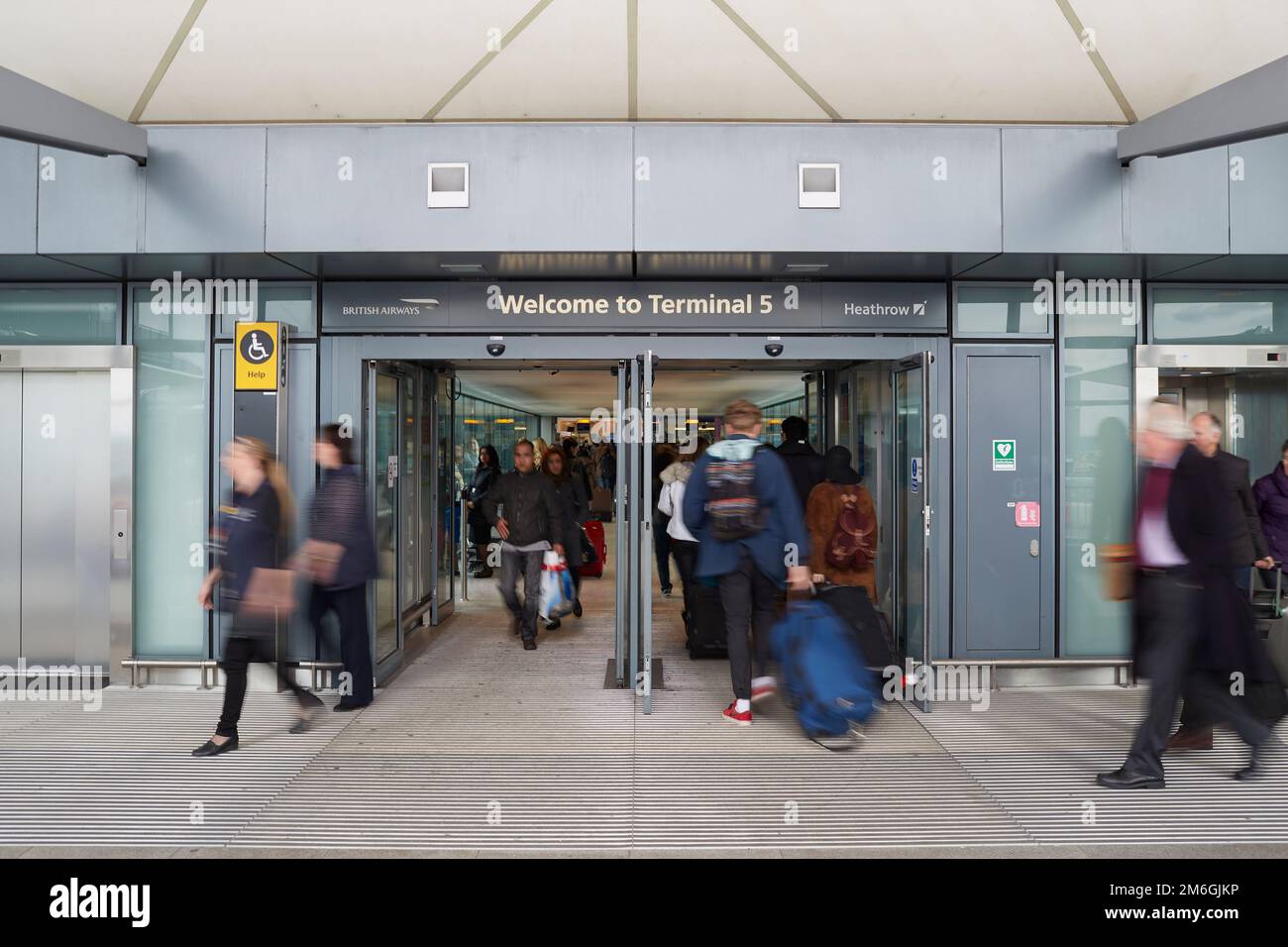 Travellers move through Heathrow Airport Terminal 5 in London Stock ...