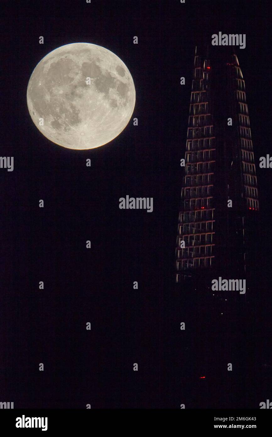 A superman rises over the tip of the Shard skyscraper Stock Photo - Alamy