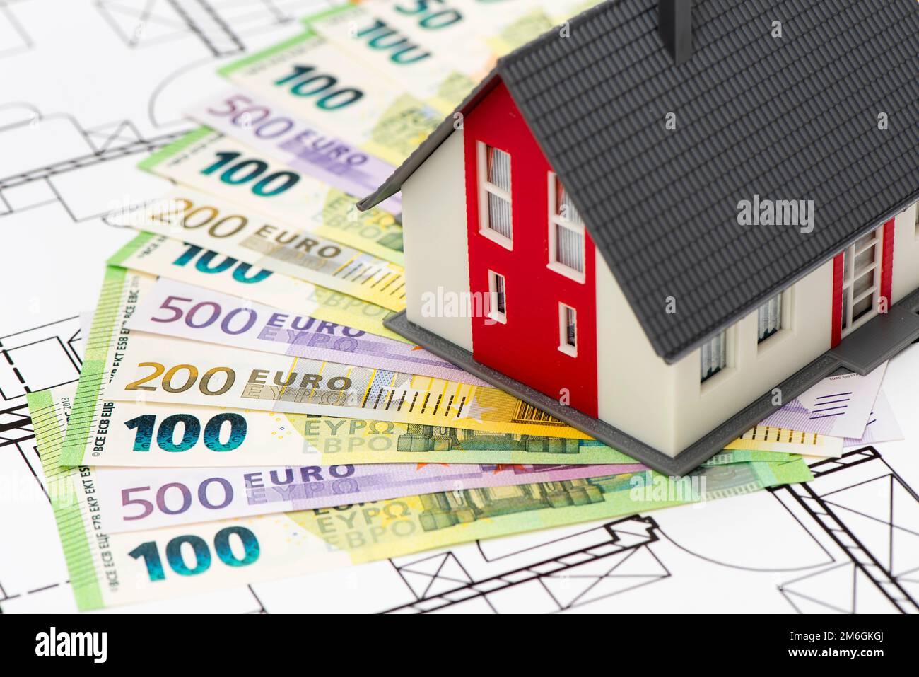 Model house stands on euro money bundle Stock Photo - Alamy
