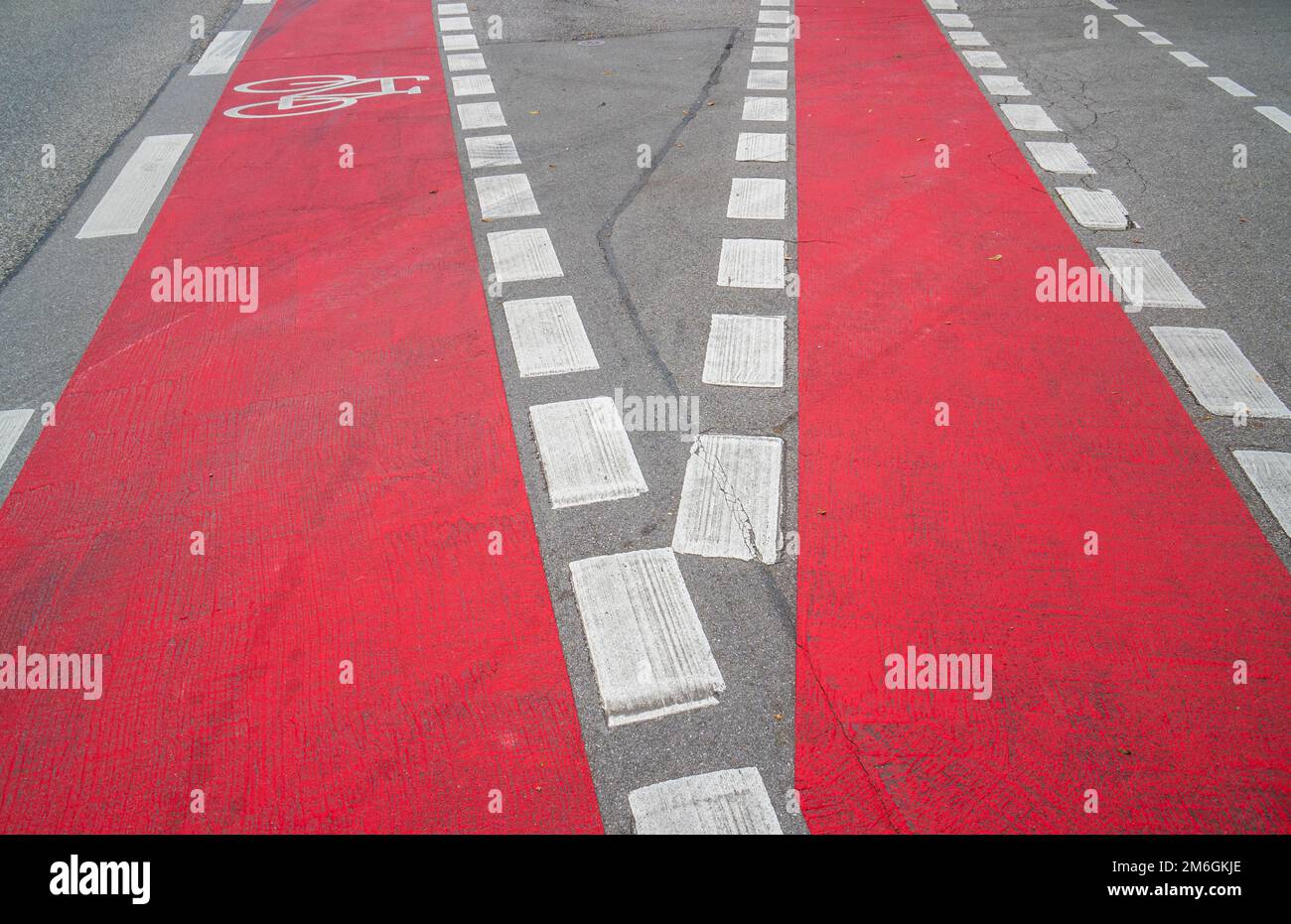 Cycle path with red marking Stock Photo - Alamy